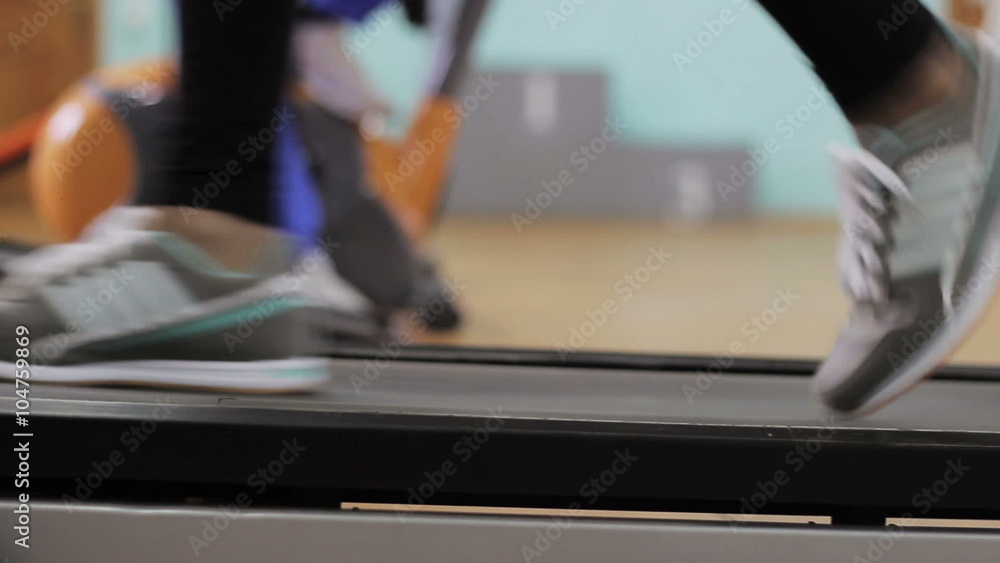 Woman running on a treadmill. Close-up shot Running on a Treadmill ...