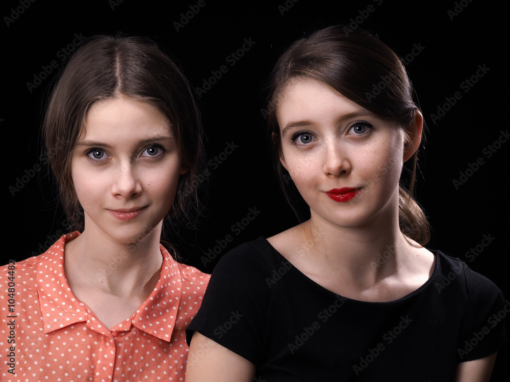 Two sisters. Gorgeous girls, teenagers - twin sisters. The girls are ...