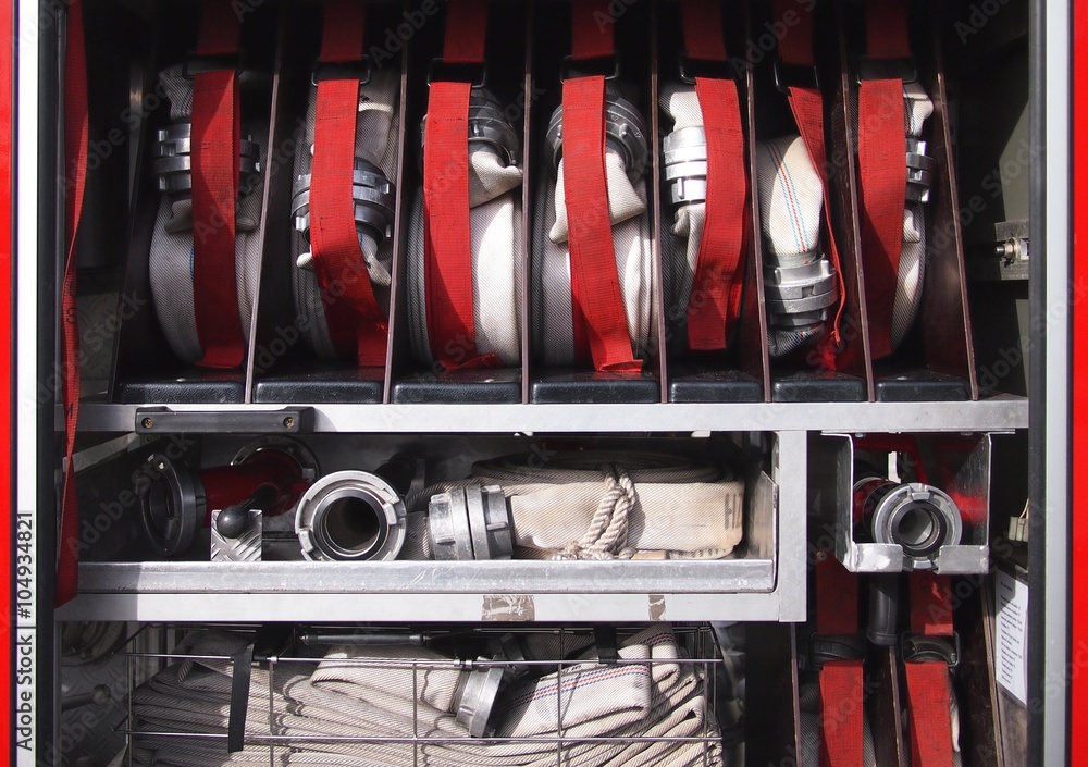 Inside of a fire truck - fire hoses prepared for usage. Photos | Adobe ...