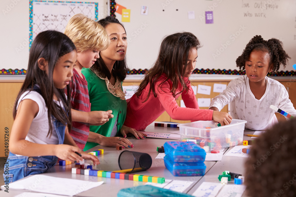 Elementary school teacher uses block play in class with kids Stock ...