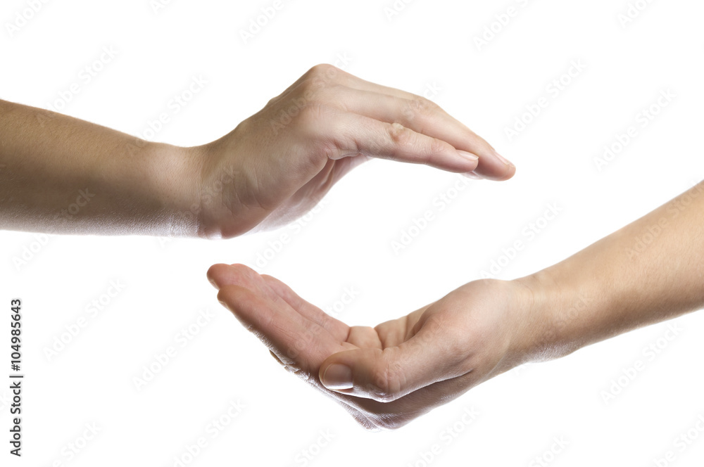 isolated image of two hands facing each other as a symbol of protection ...