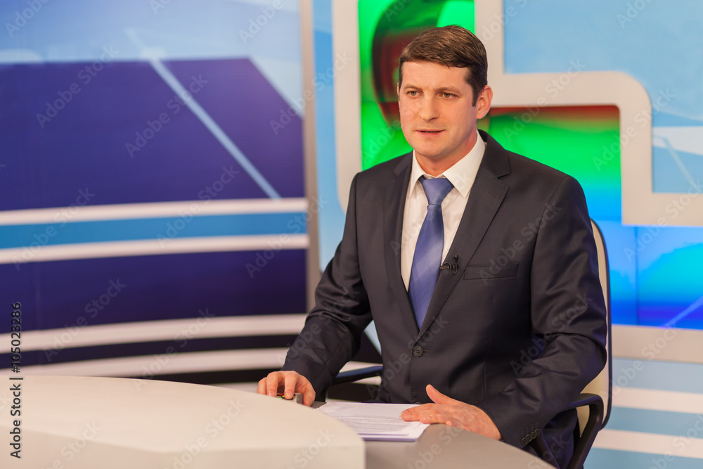 Male anchorman in tv studio. Live broadcasting Stock Photo | Adobe Stock