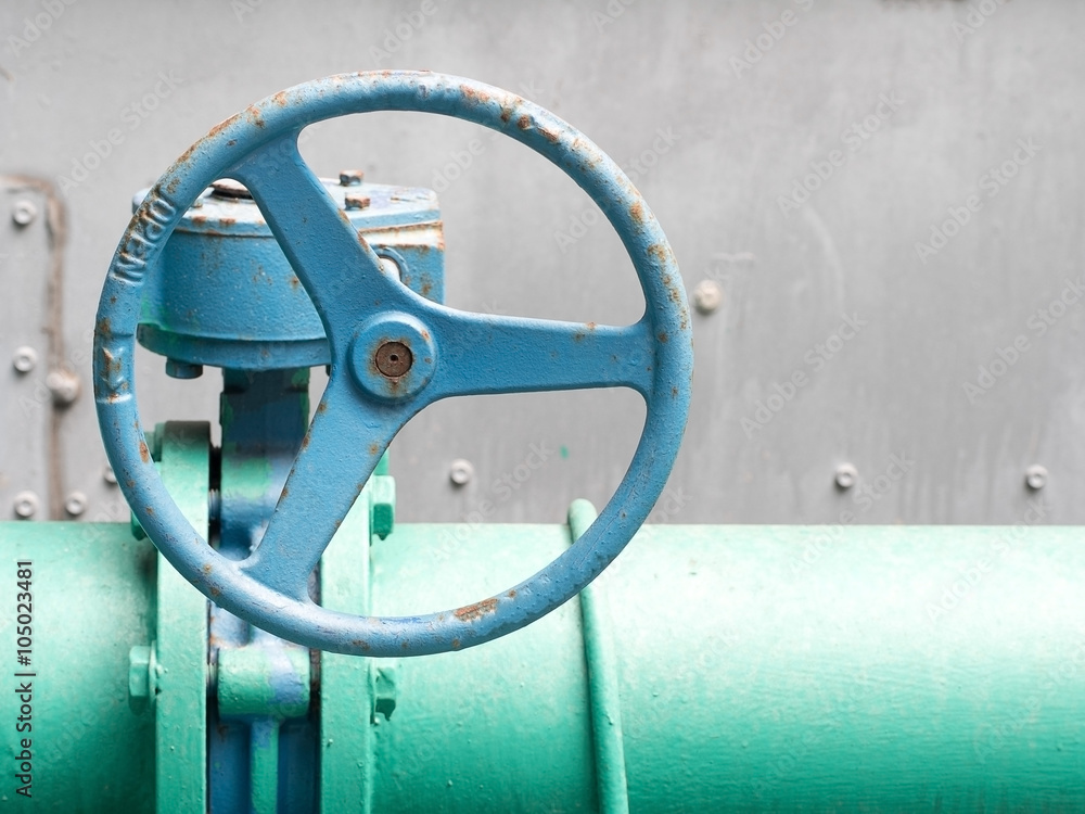 Blue old valve and old green pipe. Industrial water valve. Stock Photo ...