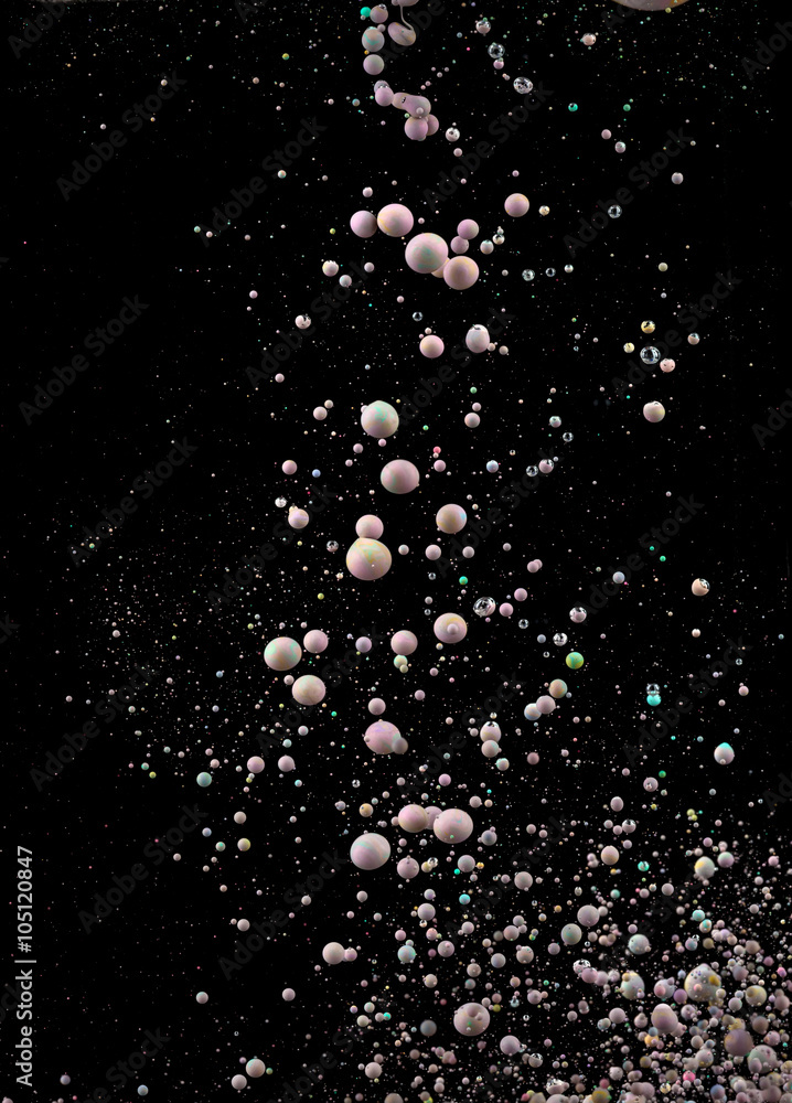 Photographs of oil drops creating bubbles. A detailed colorul abstract ...