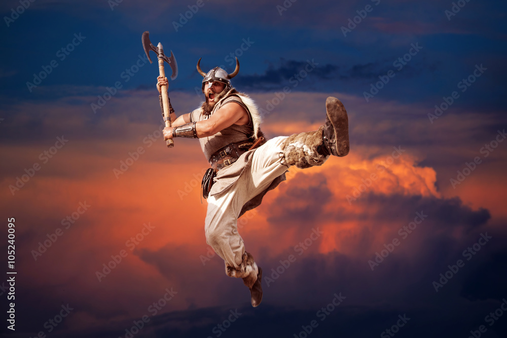 crazy strong viking with traditional costume attacking and jumping from ...
