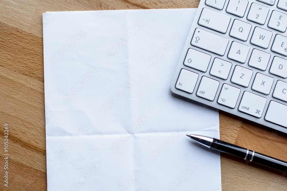 Office desk with keyboard, pen and paper Stock Photo | Adobe Stock