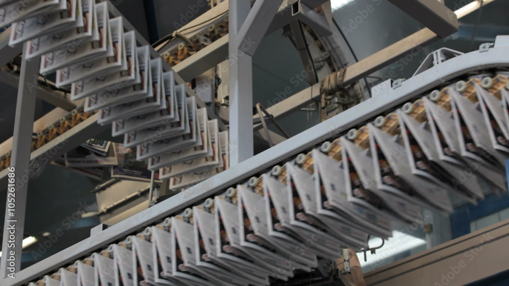 printing paper and newspaper, diagonal shot of conveyor belt ...