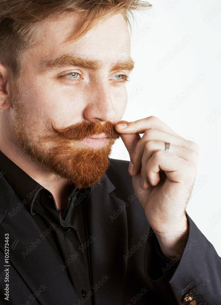 young red hair man with beard and mustache in black suit on white ...