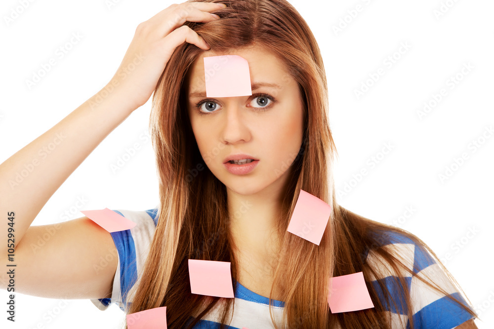 Teenage woman covered with post it notes Stock Photo | Adobe Stock