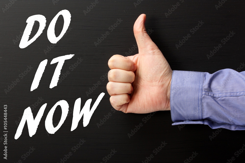 Hand in a business shirt giving the thumbs up sign to the words Do It ...
