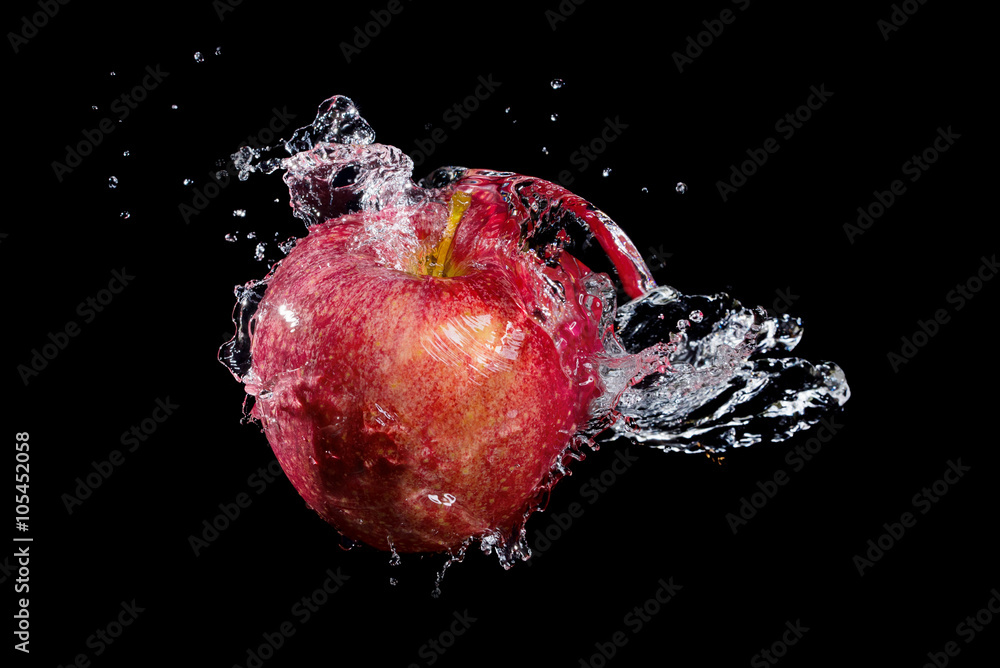Red apple with water splash against black background Stock Photo ...