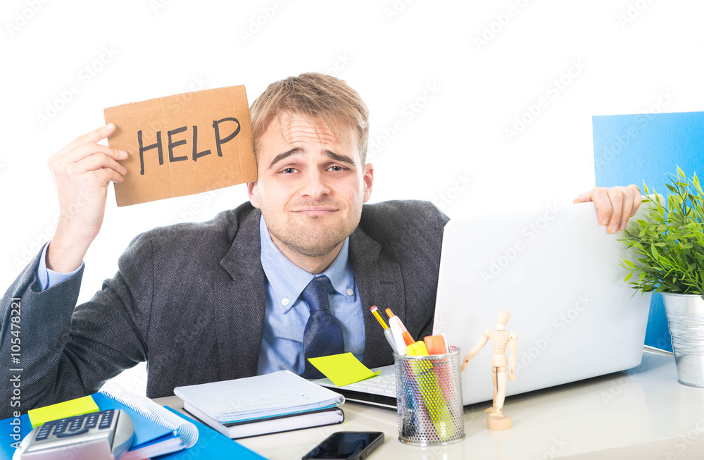 young desperate businessman holding help sign looking worried suffering ...
