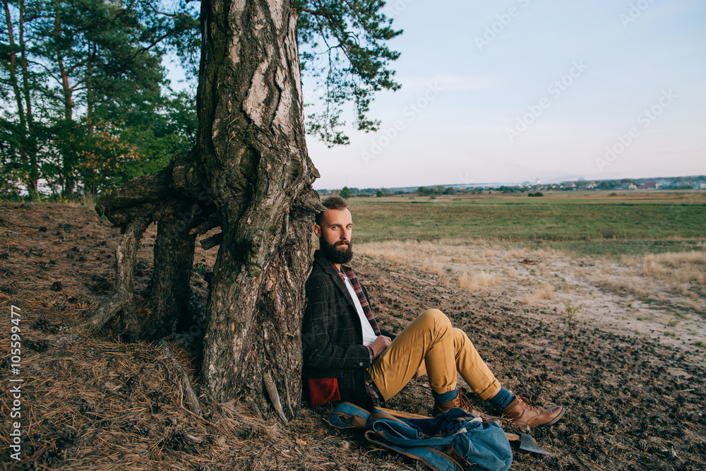 Hipster portrait brutal bearded and moustached woodcutter Gypsy man in ...