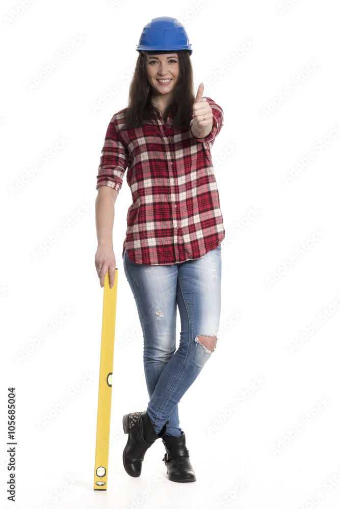 Weiblicher Handwerker mit Wasserwaage zeigt Daumen hoch Stock-Foto ...