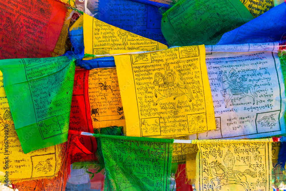 Prayer flags with traditional wooden print on them. They are used to ...