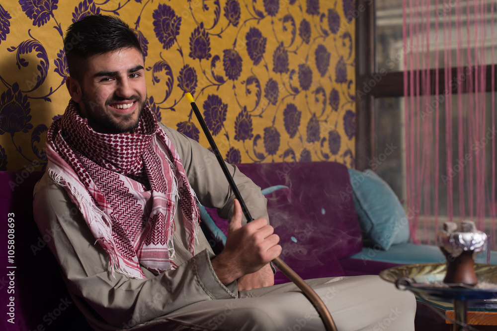 Islamic Man Smoking Shisha In The Arabic Cafe Stock 写真 | Adobe Stock