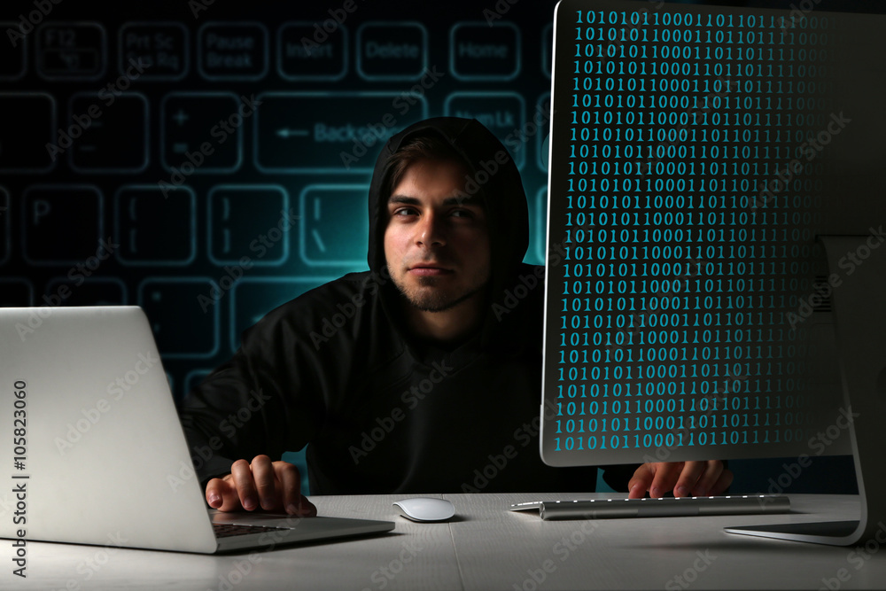Hacker working with computer Stock Photo | Adobe Stock