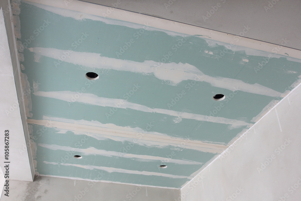 Installation of a suspended ceiling, interior of a residential house ...