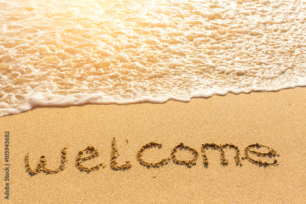 Welcome - drawn on beach sand, soft wave with solar flares. Stock Photo ...