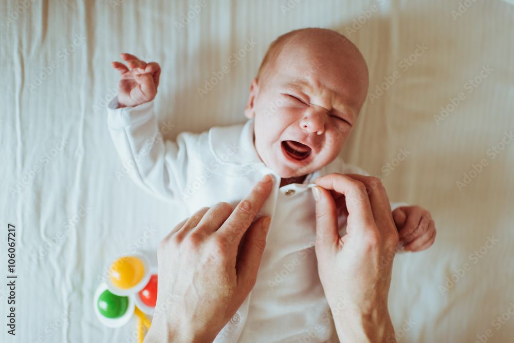 how to wear a little restless child Stock Photo | Adobe Stock