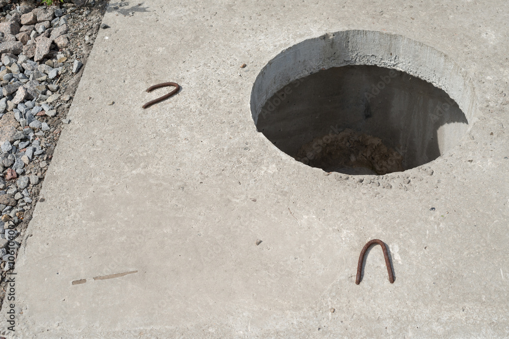 Manhole without cover in new concrete block Stock Photo | Adobe Stock