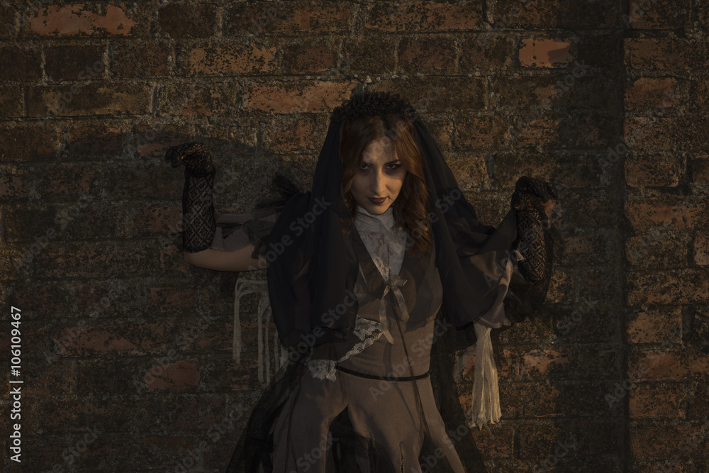 Young beautiful demonic female. Sad woman in mourning black veil on ...