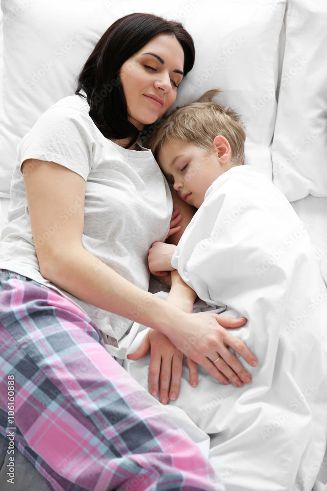 Mom sleeping with her son, closeup Stock Photo | Adobe Stock