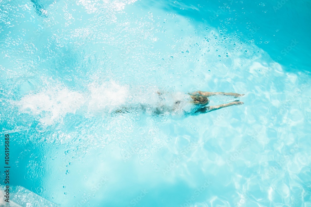 Woman diving in the pool Stock Photo | Adobe Stock