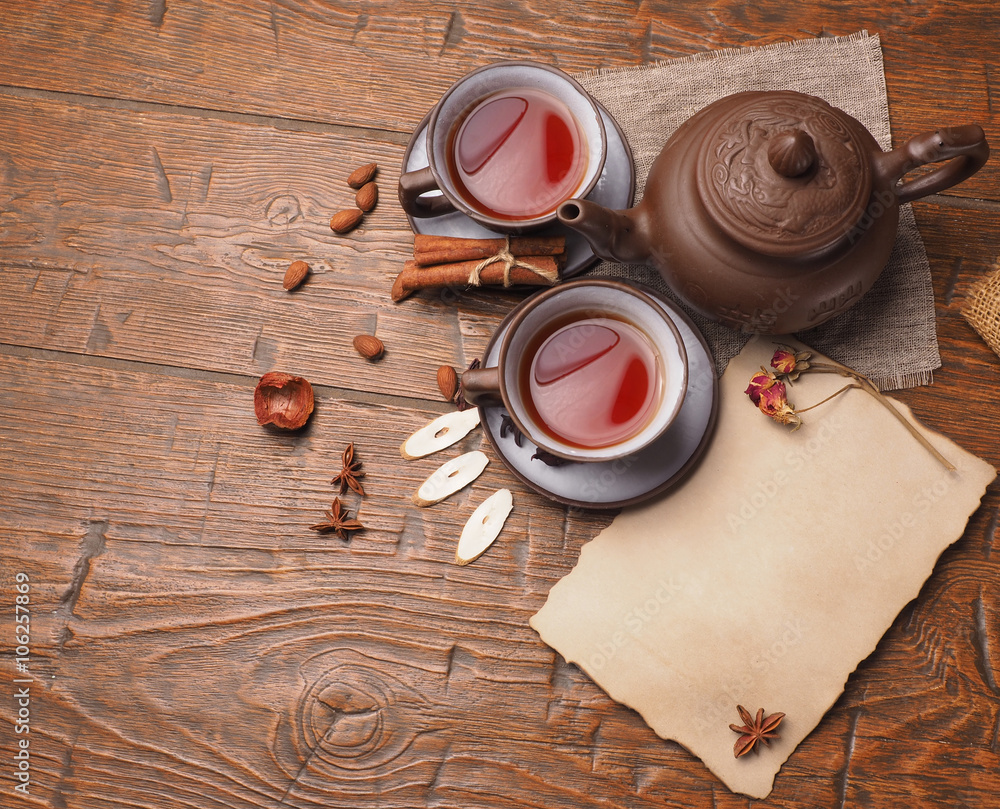 old paper and tea set on a wooden background Stock Photo | Adobe Stock