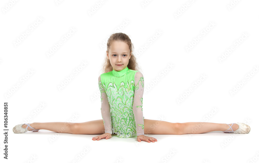 Gymnast cute little girl sitting on the floor. The child in the ...