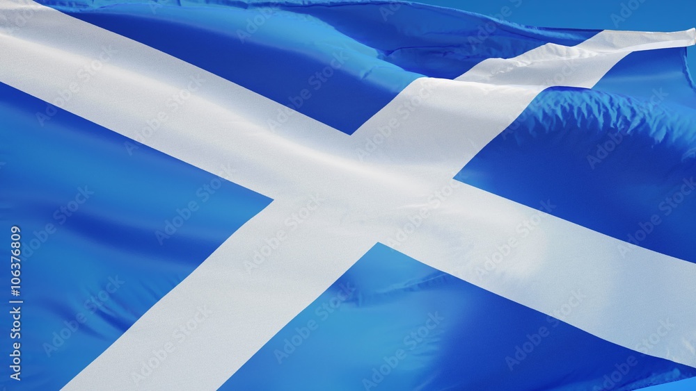 Scotland flag waving in slow motion against clean blue sky, seamlessly ...
