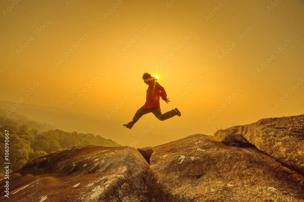 silhouette man jumping into sunset sky Stock Photo | Adobe Stock
