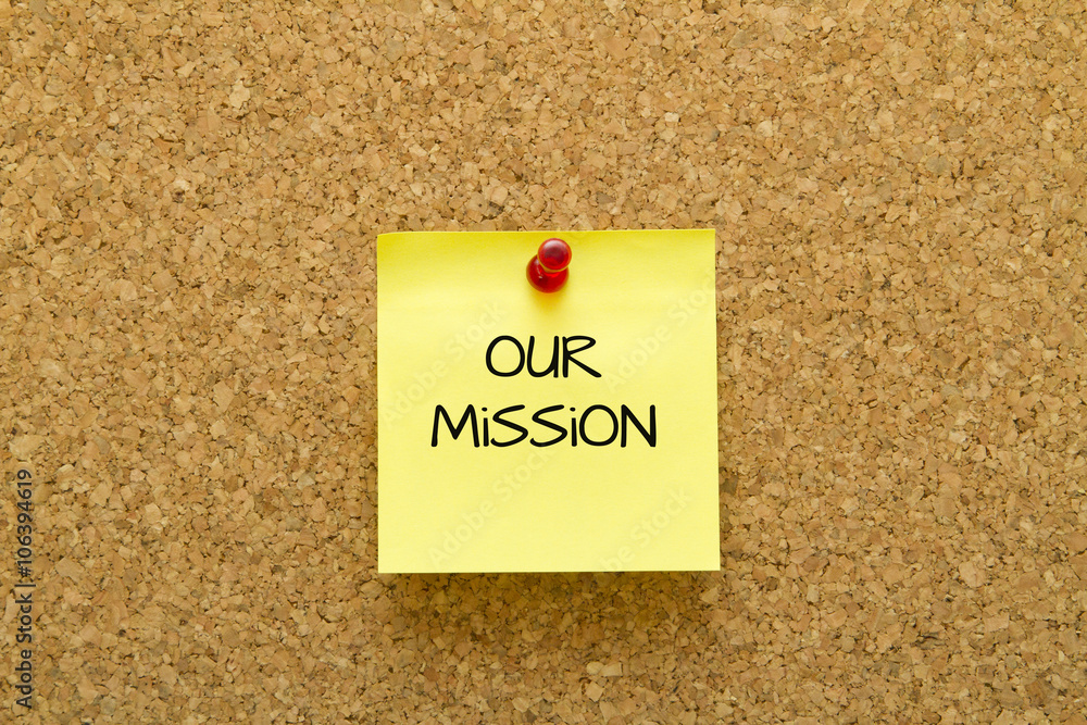 Our mission word written on a yellow sticky note on cork board Stock ...