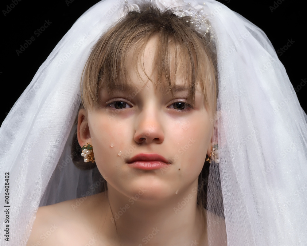 Teen girl - the bride. Portrait of a young, weeping bride. The concept ...