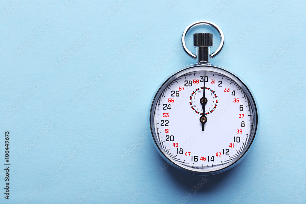Stopwatch on blue background, close up Stock Photo | Adobe Stock