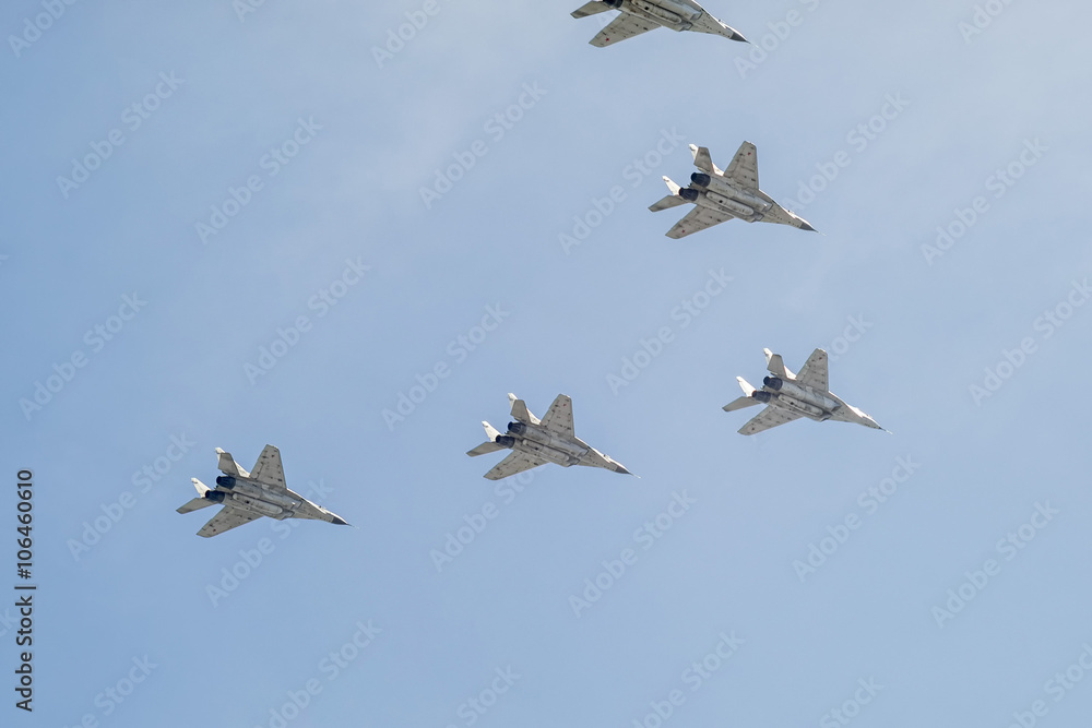 Mikoyan-Gurevich MiG-29SMT (Fulcrum) jet fighter aircrafts fly on blue ...