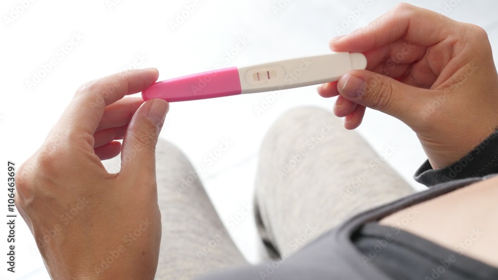 Excited female holding in hands positive home pregnancy test 4K 2160p ...