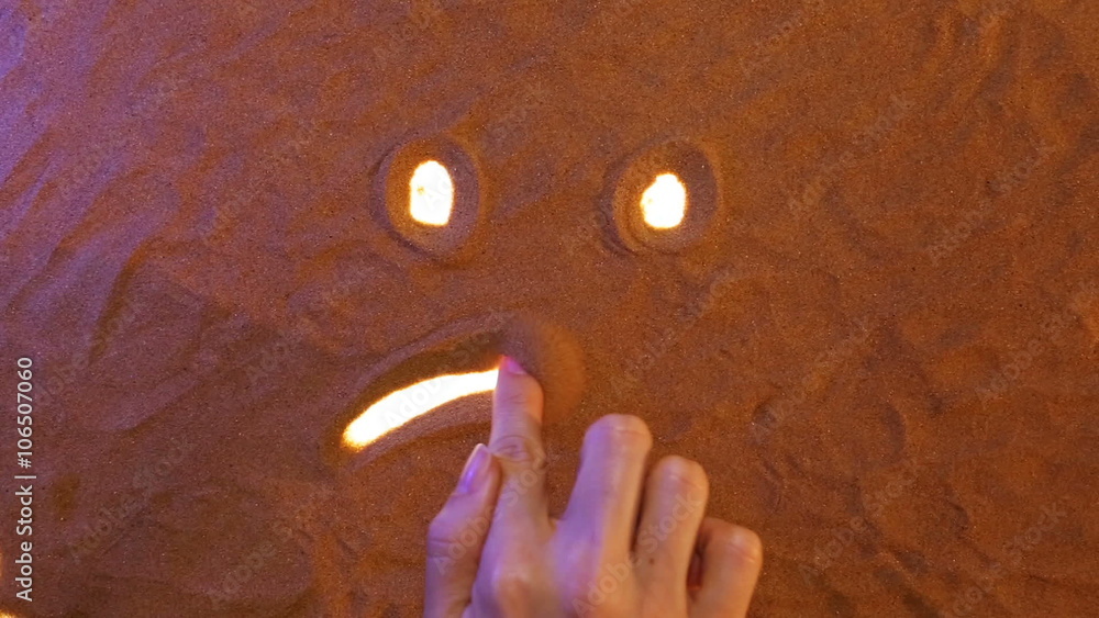 Hand drawing Sad Smile (emoticon) icon in the Sand. Beach background ...
