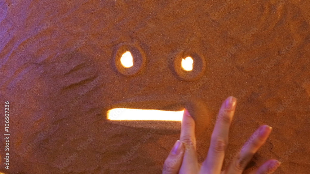 Hand drawing Serious Smile (emoticon) in the Sand. Beach background ...