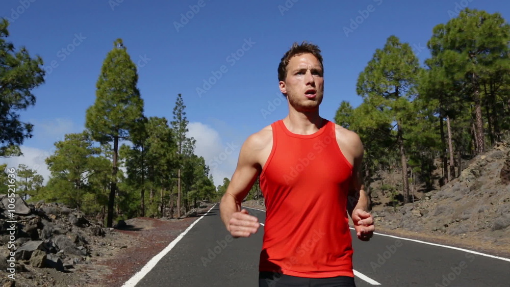 Running man - male runner jogging outdoors on road training for ...