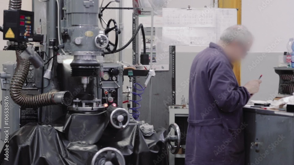 Worker of production line checks quality of the final product Stock ...