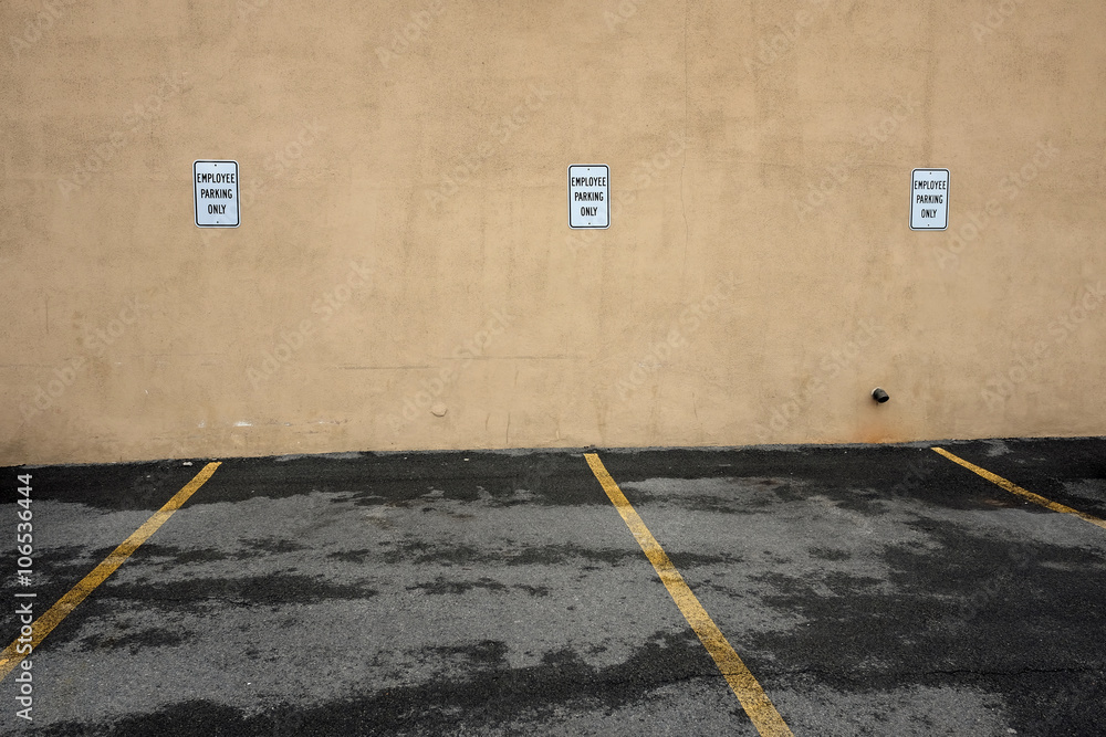 Employee Parking Signs in Empty Parking Spots Stock Photo | Adobe Stock