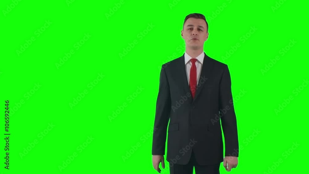 Young TV reporter in suit telling about latest news during his ...