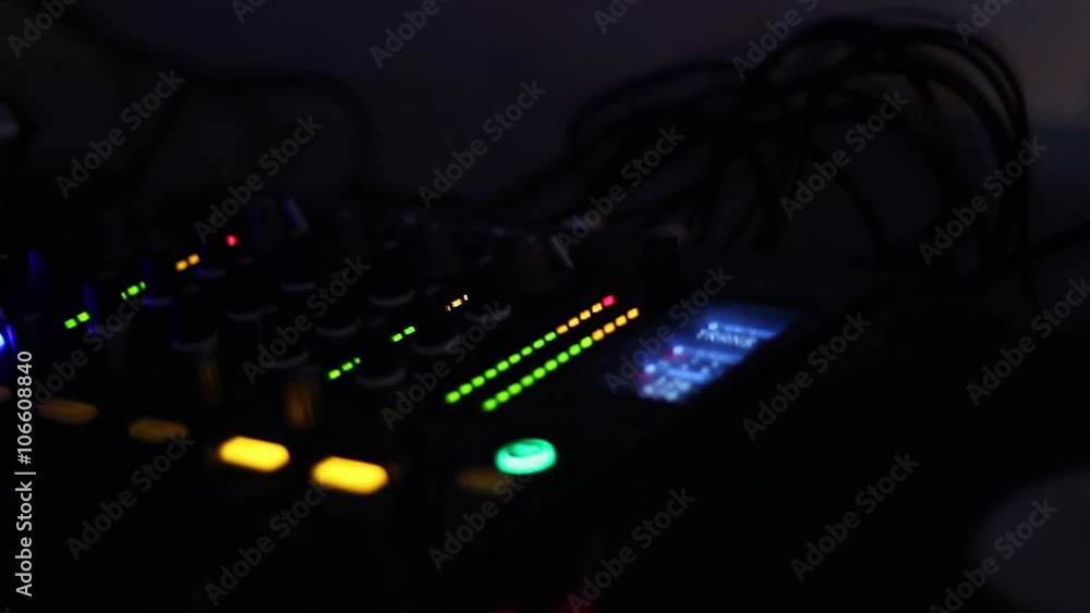 Night club, party, flashing lights on the cool mixing console. DJ ...
