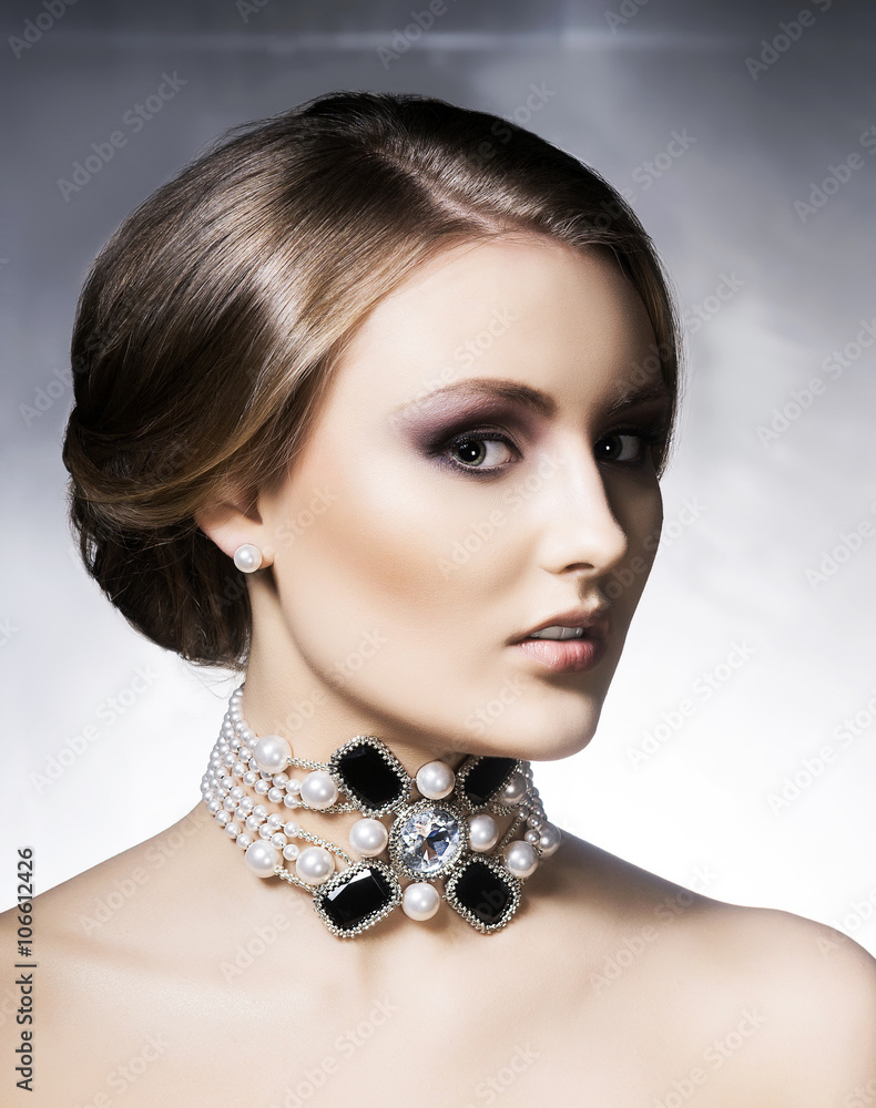Young, beautiful and rich woman in jewels Stock Photo | Adobe Stock