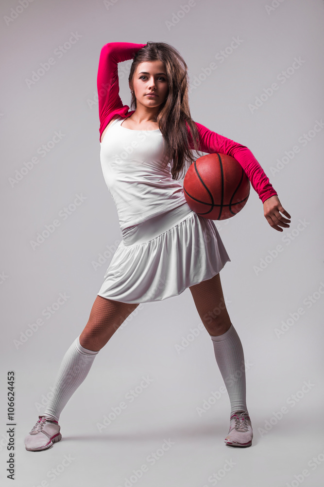 Portrait of young female basketball player passing the ball. Beautiful ...