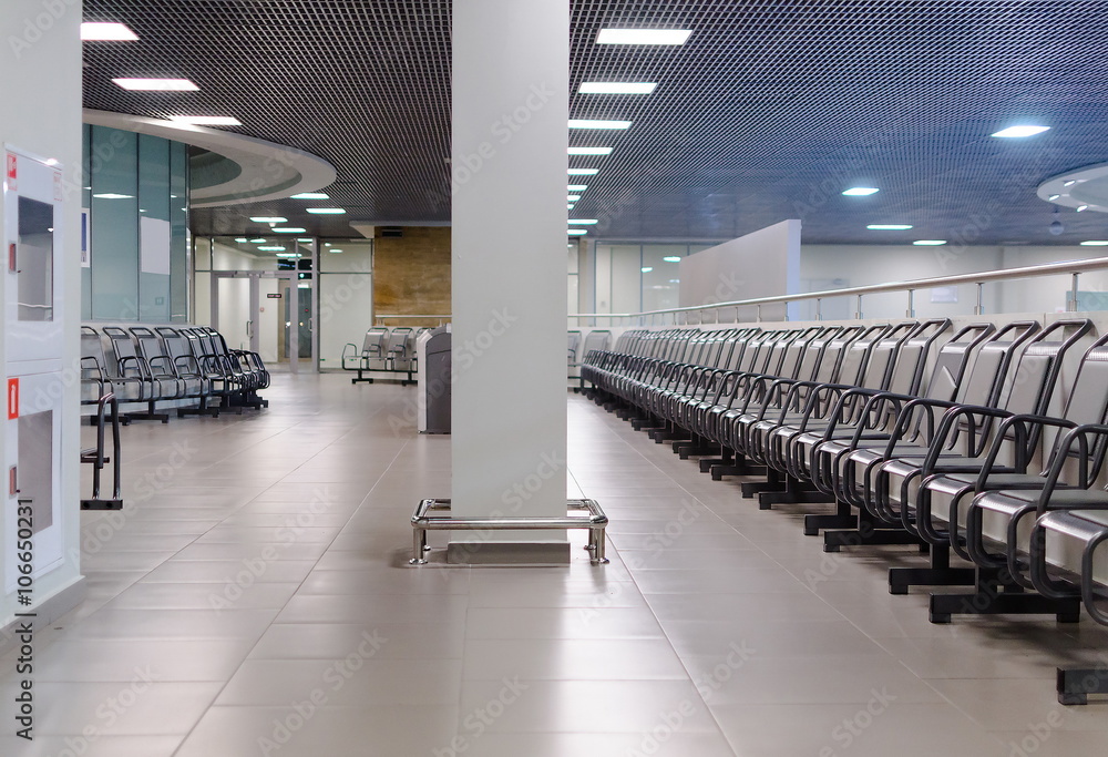 Waiting zone in an airport with chairs. Stock Photo | Adobe Stock