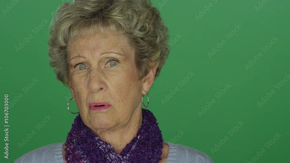 Older woman looking shocked and appalled, on a green screen studio ...