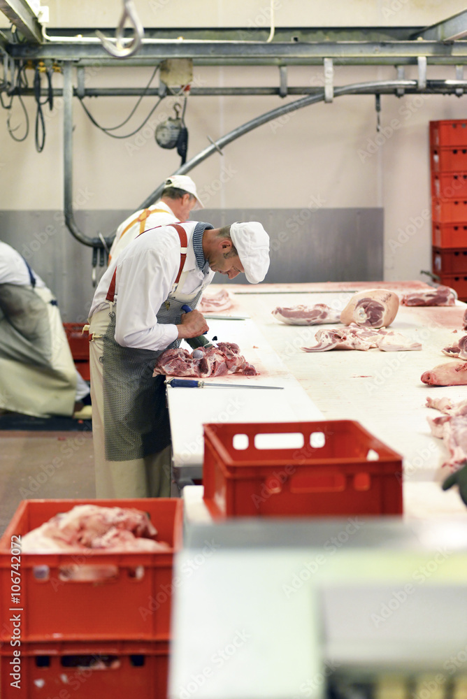 Processing of pig carcasses in a slaughterhouse Stock Photo | Adobe Stock