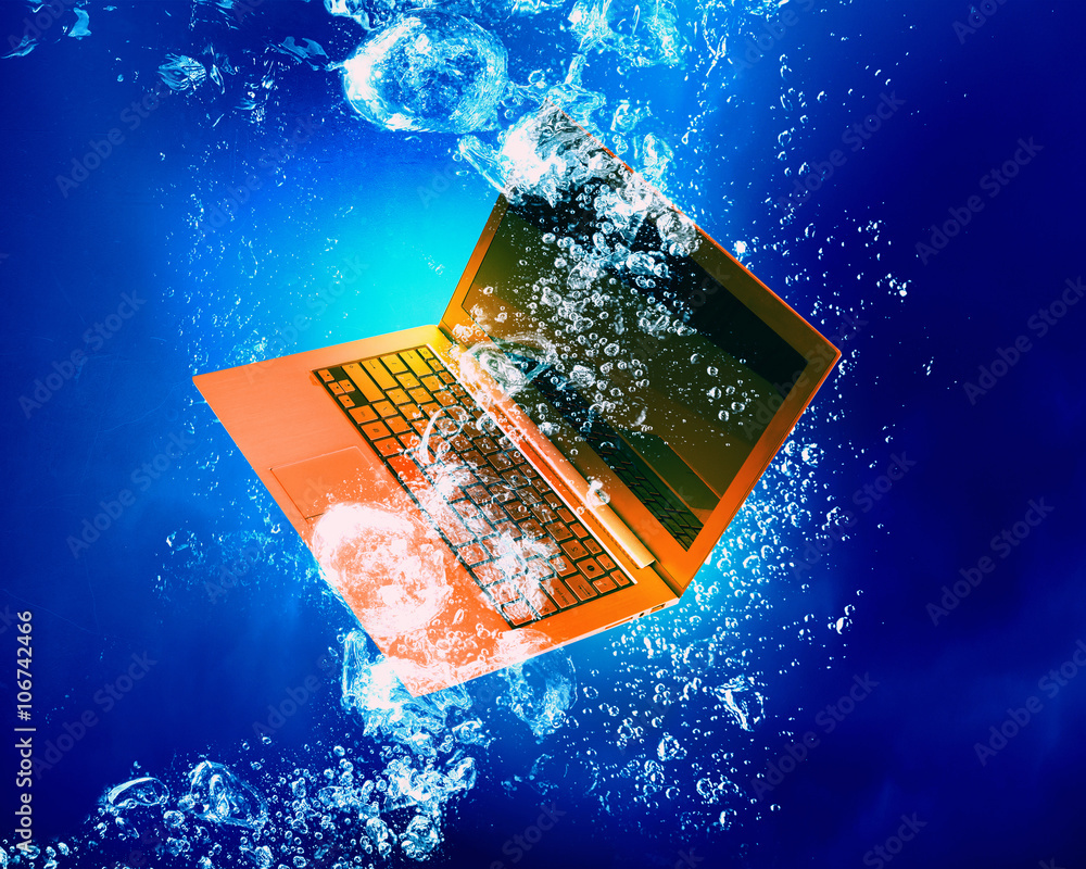 Laptop under water Stock Photo | Adobe Stock